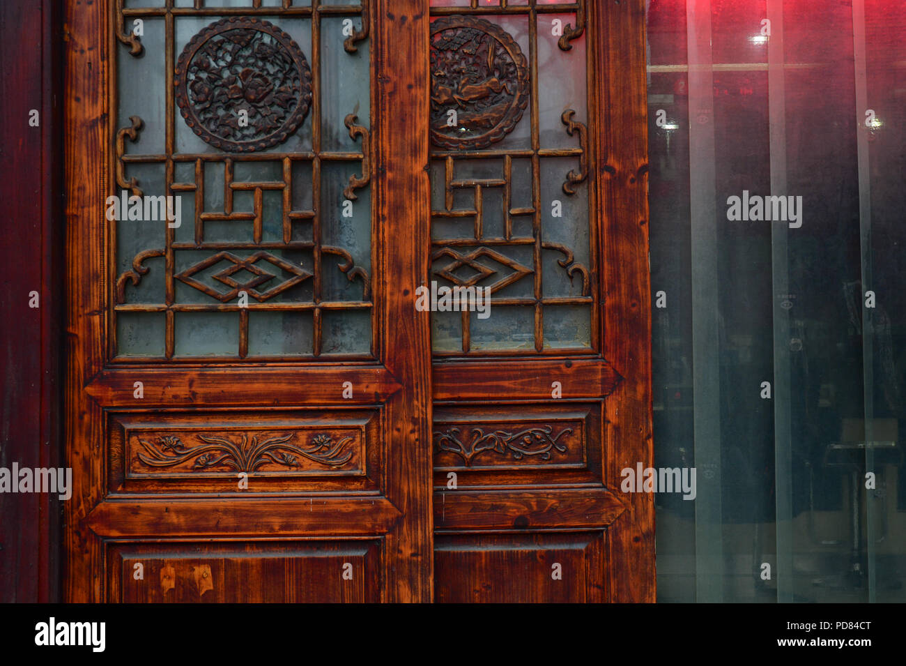 Traditional Chinese style wooden door at ancient town Stock Photo - Alamy