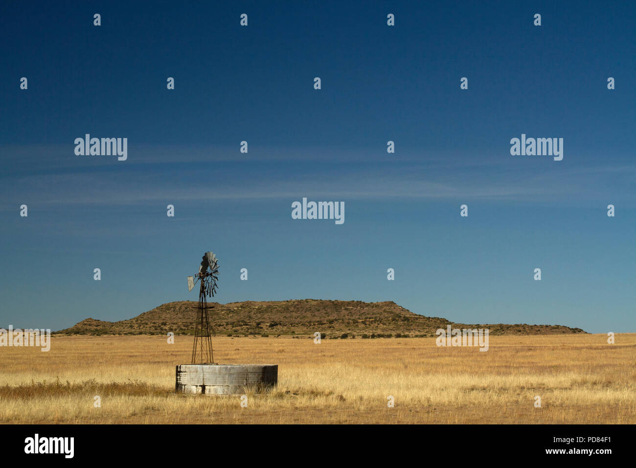 Landscape with windmill and dam Stock Photo - Alamy
