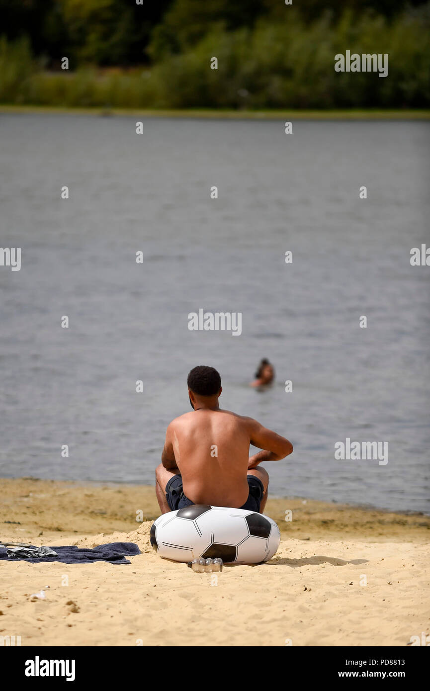 Man sunbathes next water hi-res stock photography and images - Alamy