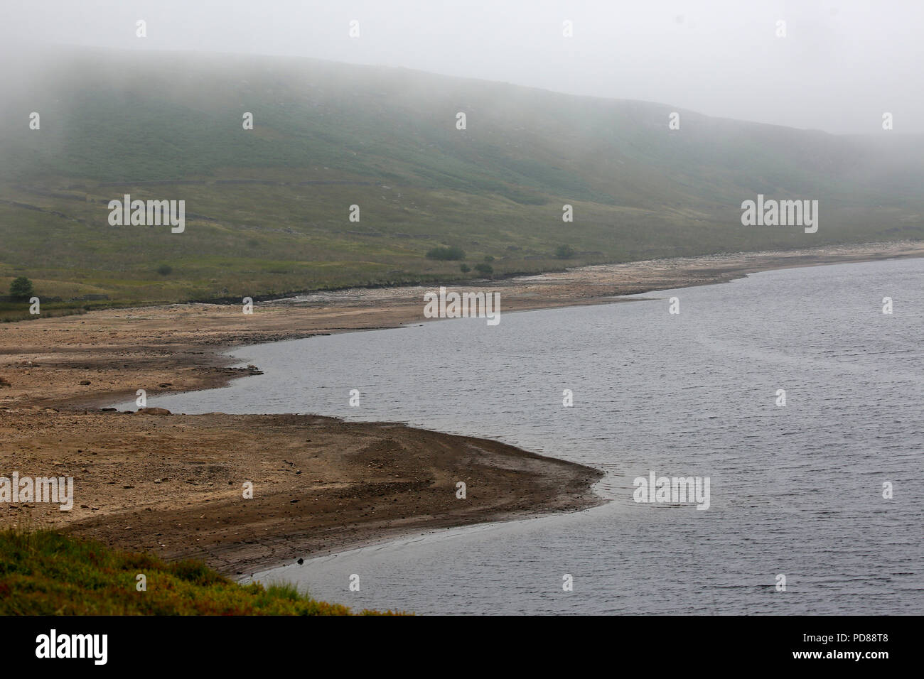 Calderdale, UK. 7th August 2018. Mist covers the landscape above Widdop ...