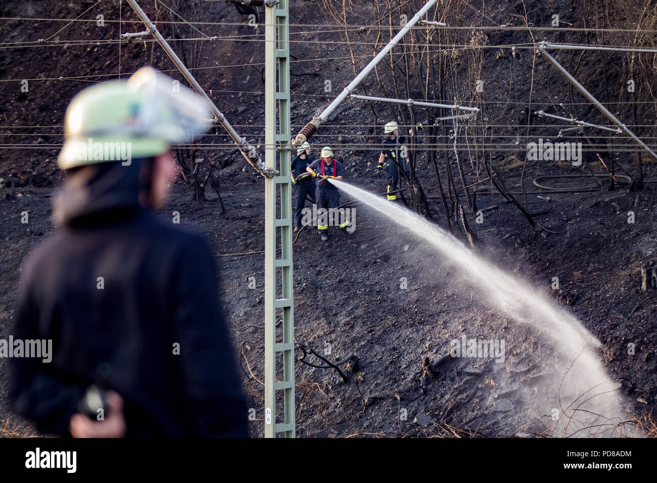 Siegburg, Germany. 07th Aug, 2018. Firefighters extinguishing an ...