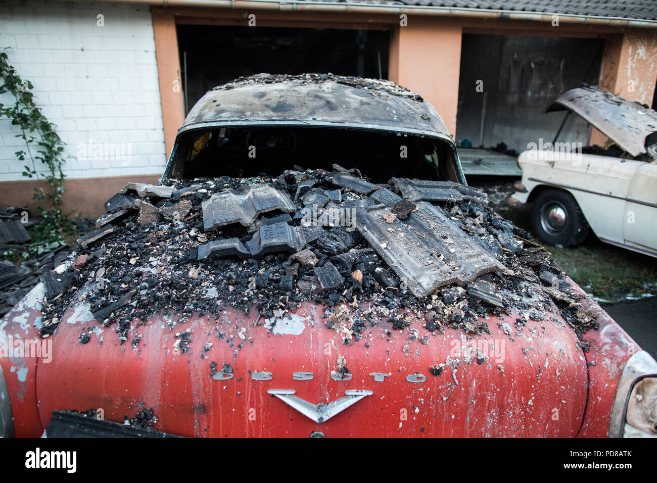 Siegburg, Germany. 07th Aug, 2018. completely burnt vintage cars ...