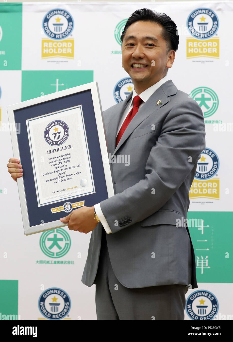 Tokyo, Japan. 8th Aug, 2018. Japan's Daishowa Paper Products president Ryosuke Saito shows his ...