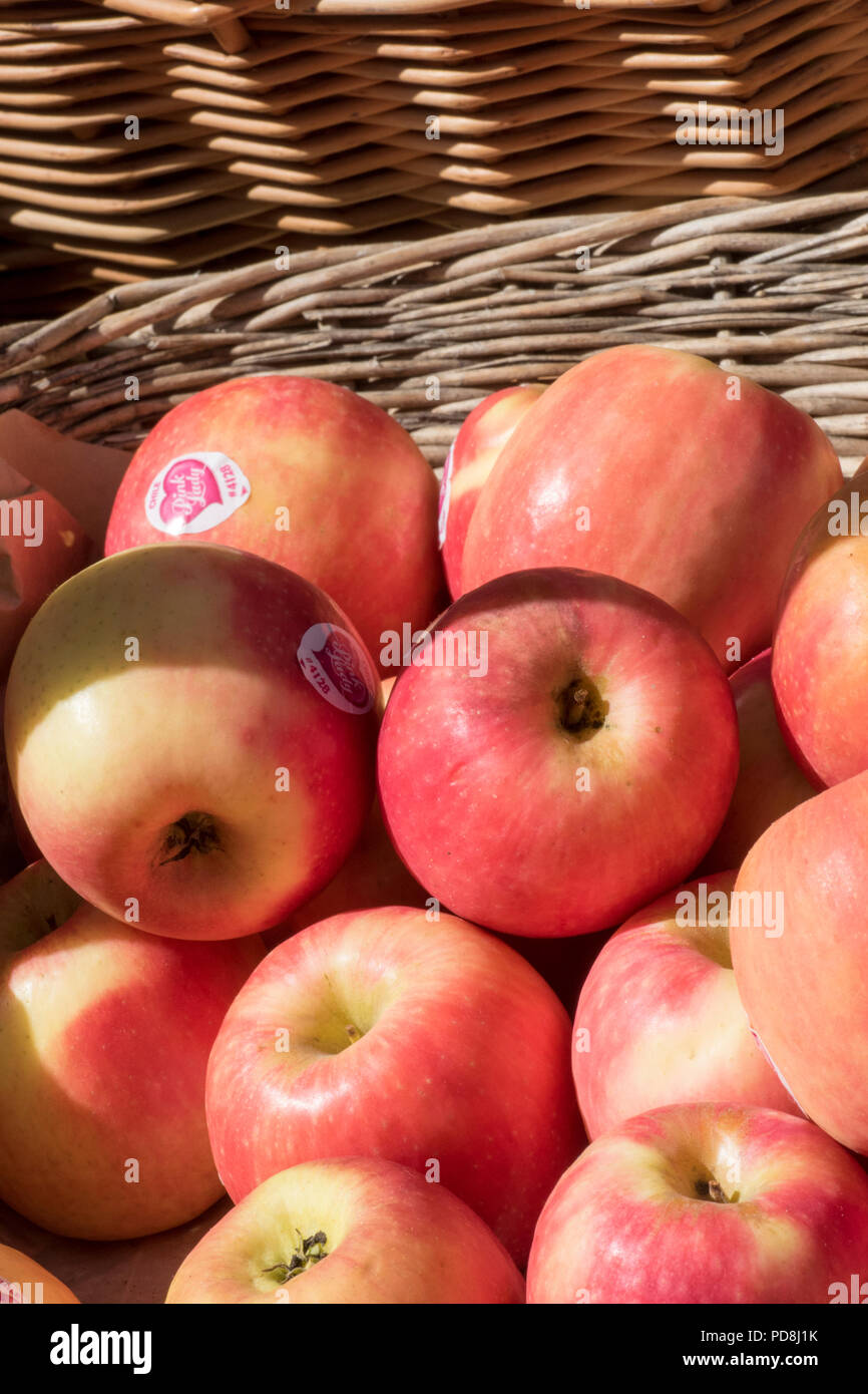 freshly picked rosy red apples in a basket on display at a fresh fruit ...