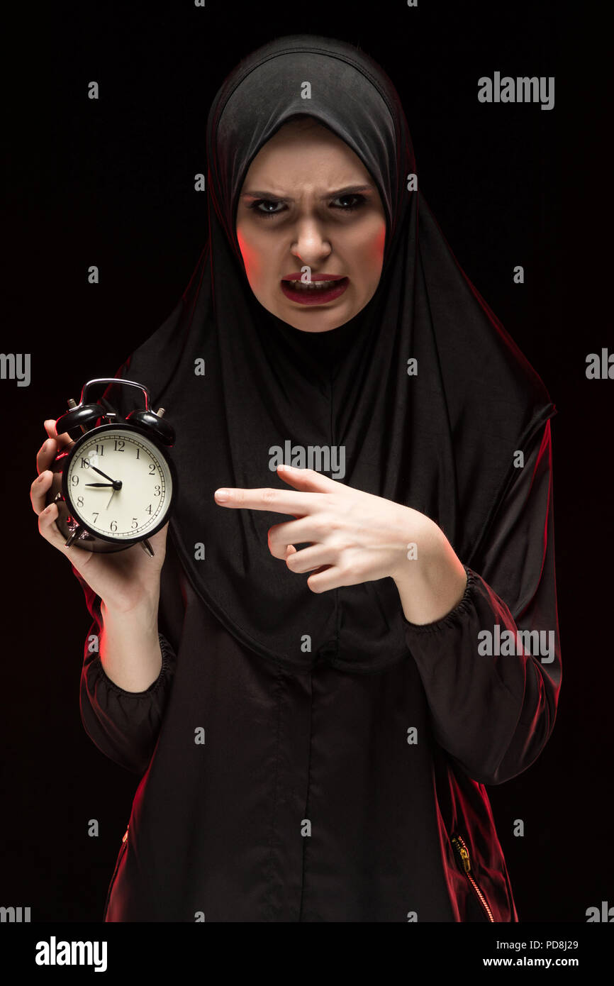 Portrait of beautiful serious scared frightened young muslim woman ...