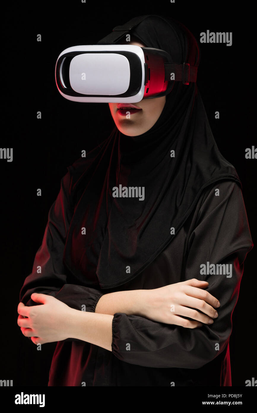 Portrait of beautiful smart young muslim woman wearing black hijab ...