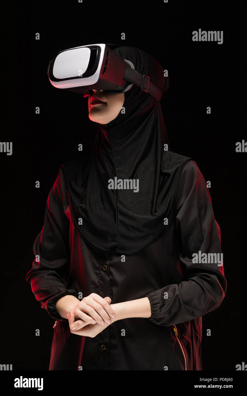 Portrait of beautiful smart young muslim woman wearing black hijab ...