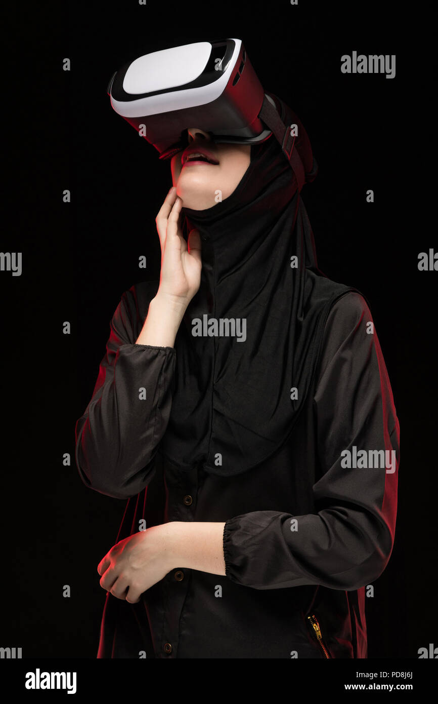 Portrait of beautiful smart young muslim woman wearing black hijab ...