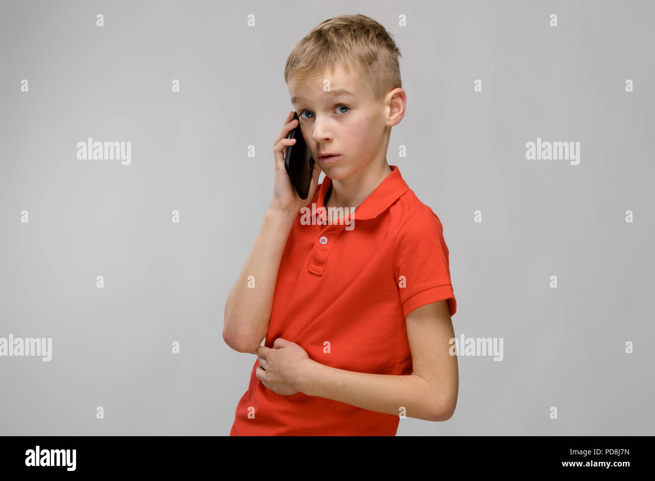 Cute boy with telephone Stock Photo - Alamy