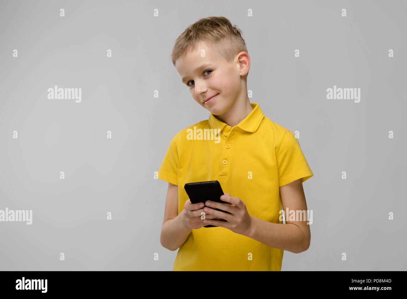 Cute boy with telephone Stock Photo - Alamy