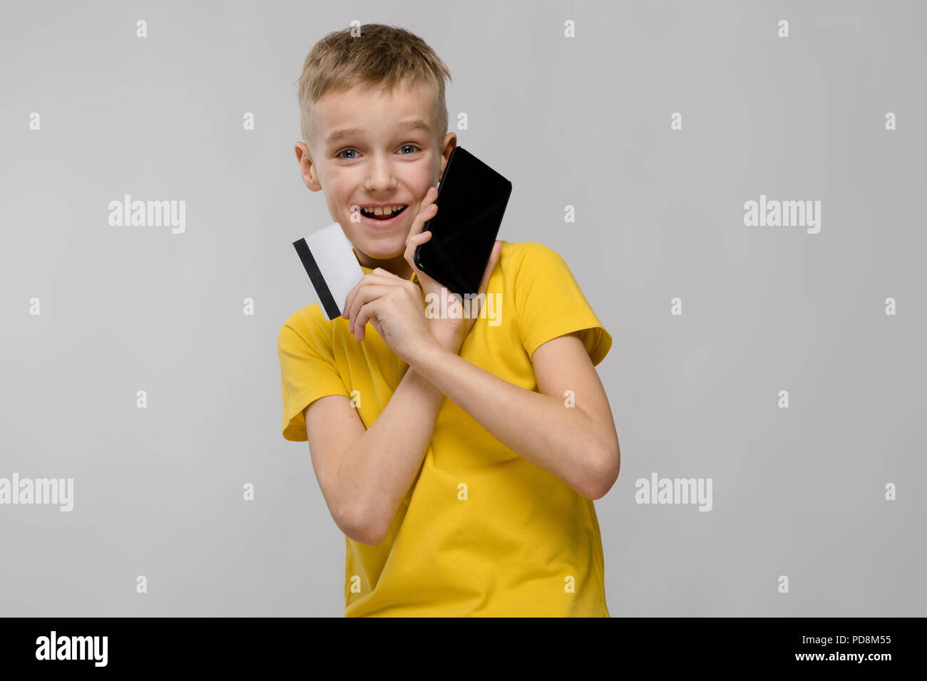 Cute boy with telephone Stock Photo - Alamy