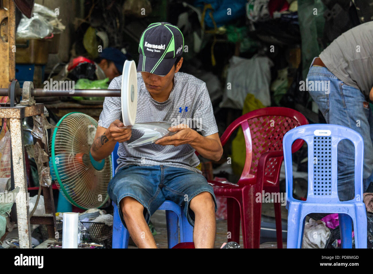 Ho Chi Minh, Asia - May 11, 2018: Local man doing manual works in a ...