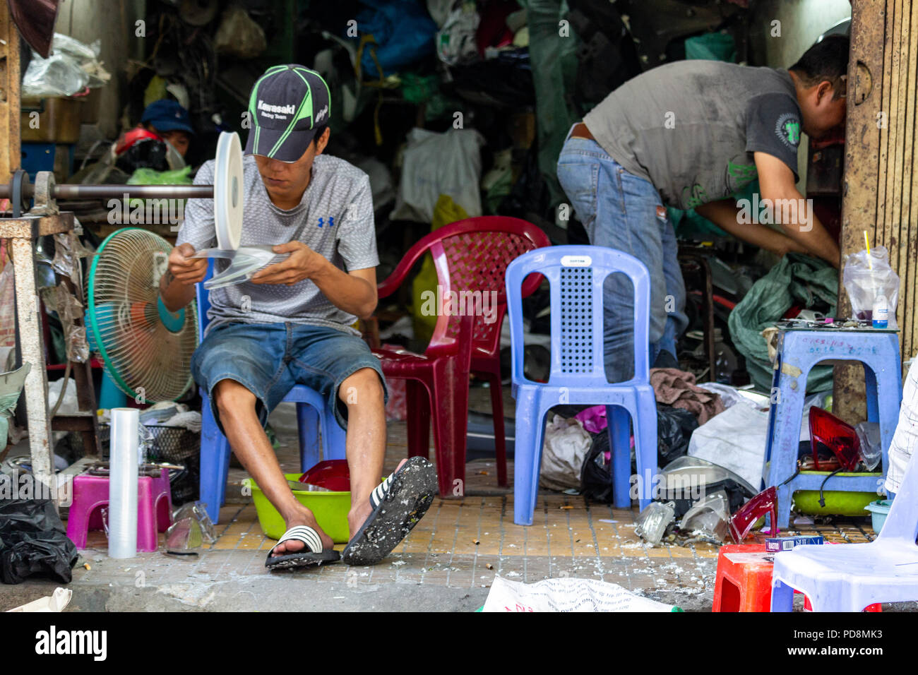 Ho Chi Minh, Asia - May 11, 2018: Local man doing manual works in a ...