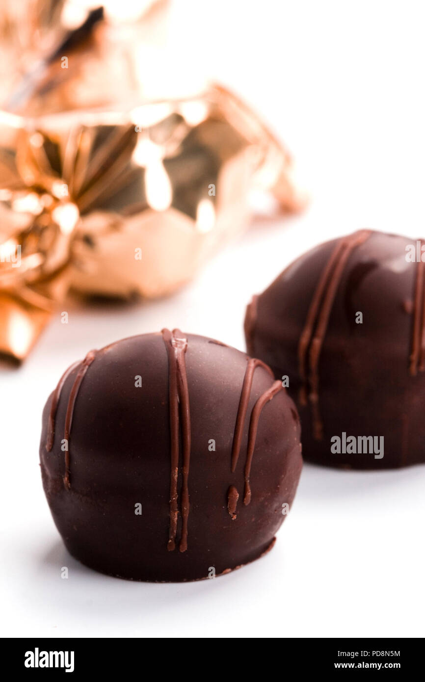 two opened foil chocolate candies closeup Stock Photo - Alamy