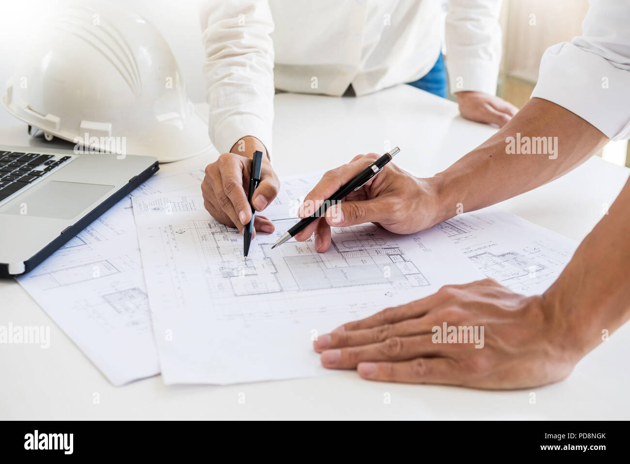 Close-up Of Person's engineer Hand Drawing Plan On Blue Print with ...