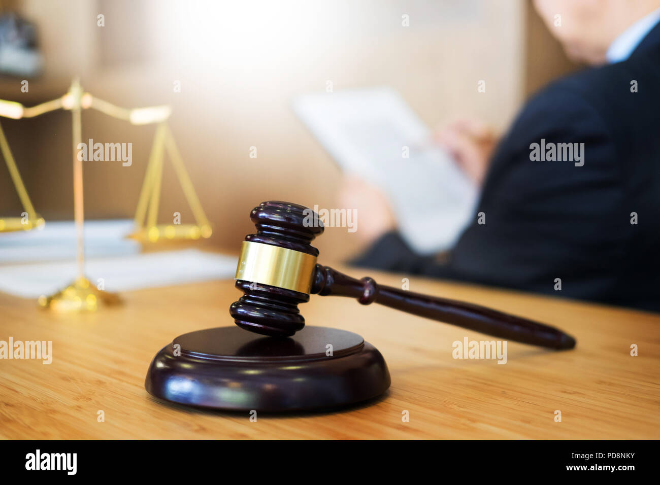 lawyer judge reading documents at desk in courtroom working on wooden ...