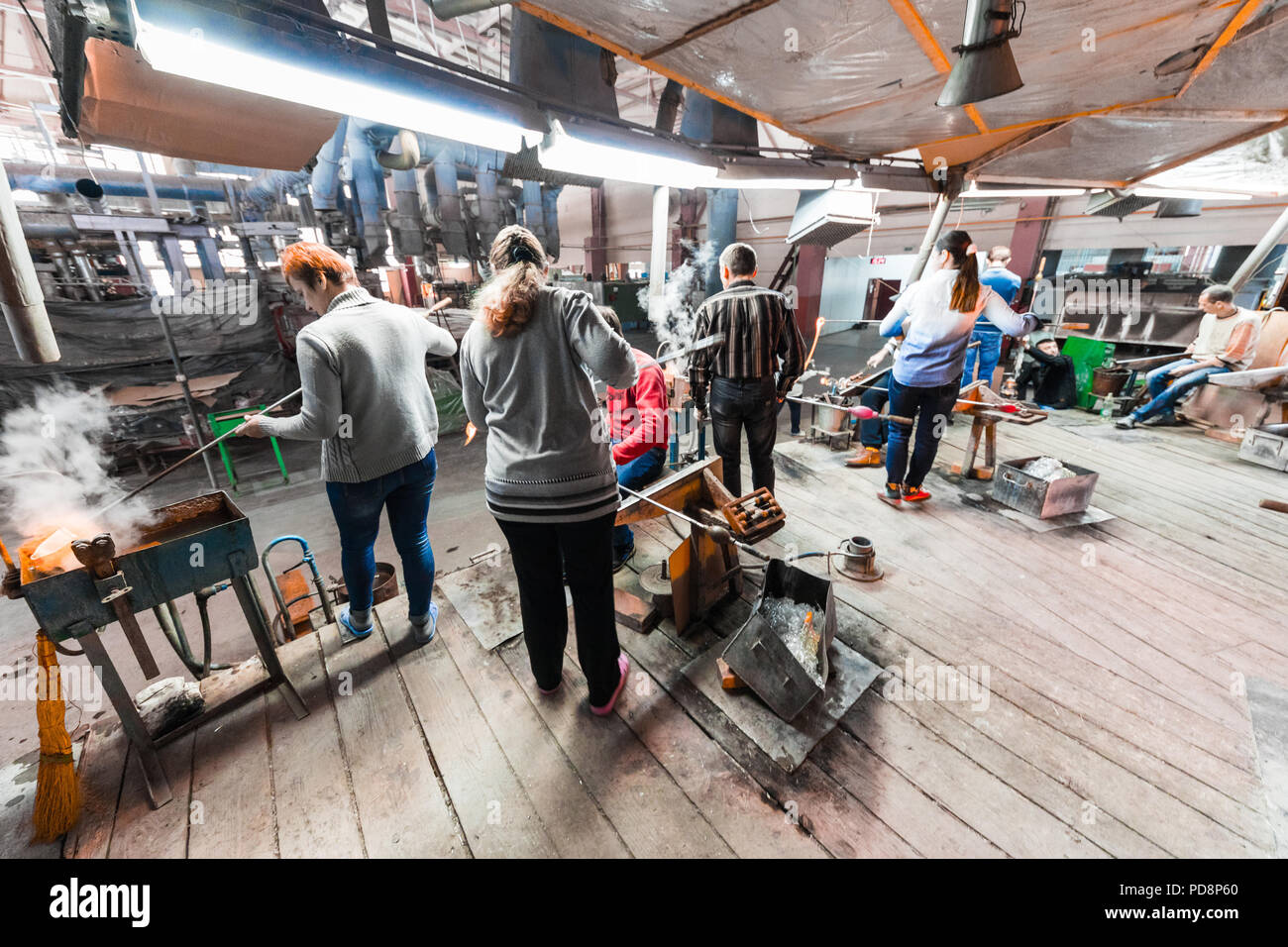 Minsk, Belarus - February 01, 2018: Glass production worker working ...