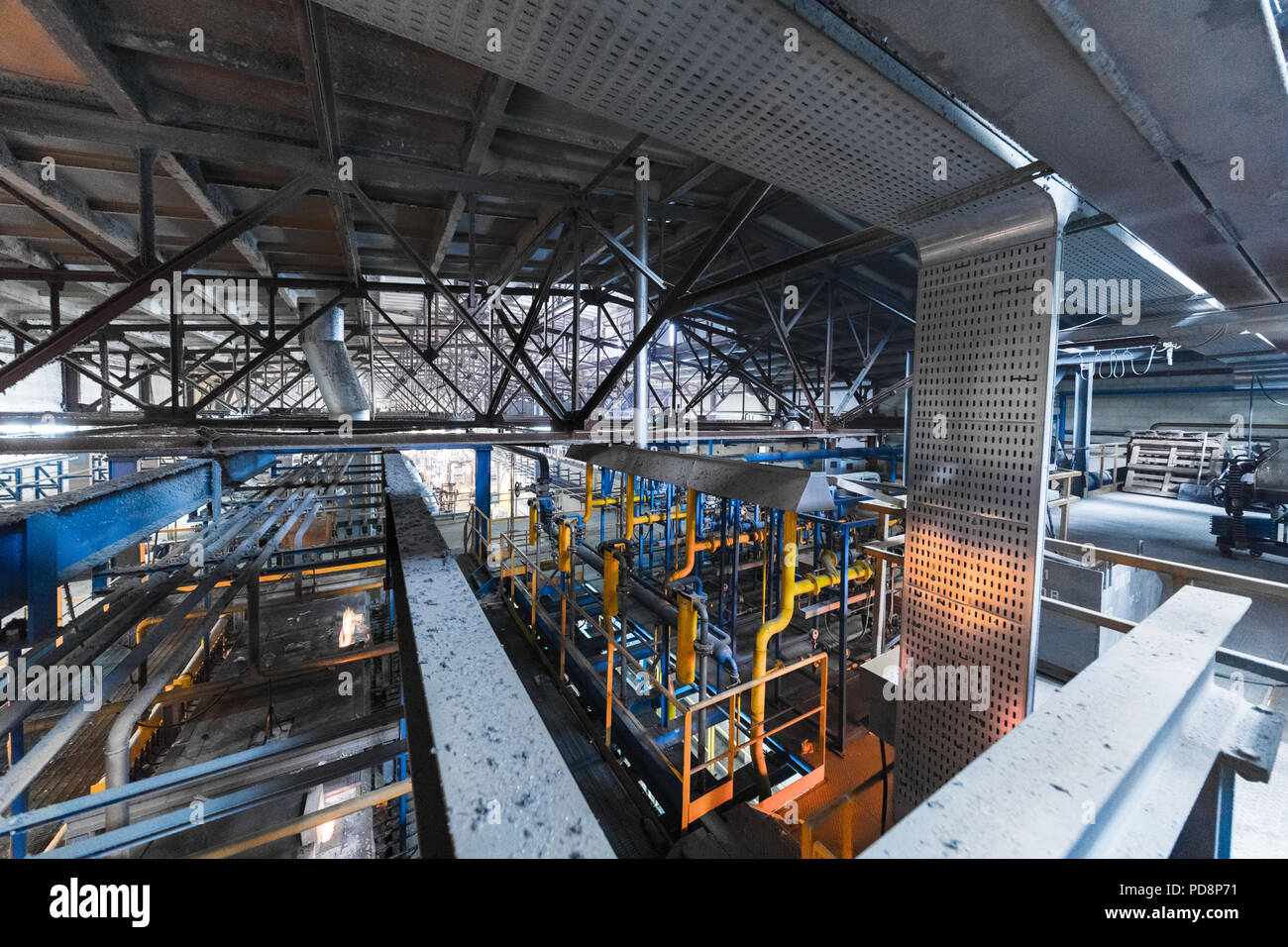 Fiberglass production industry equipment at manufacture background ...