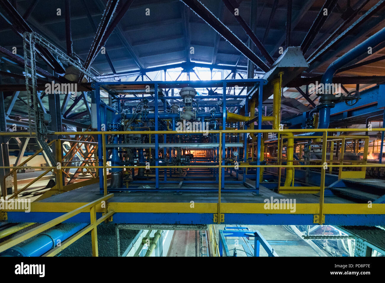 Fiberglass production industry equipment at manufacture background ...