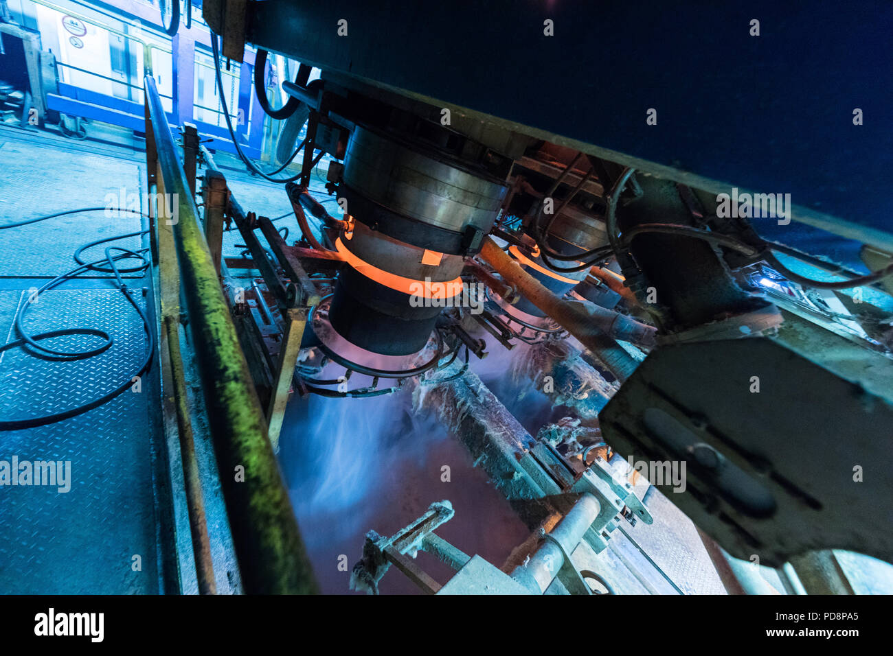 Process of fiberglass production at manufacture background with ...