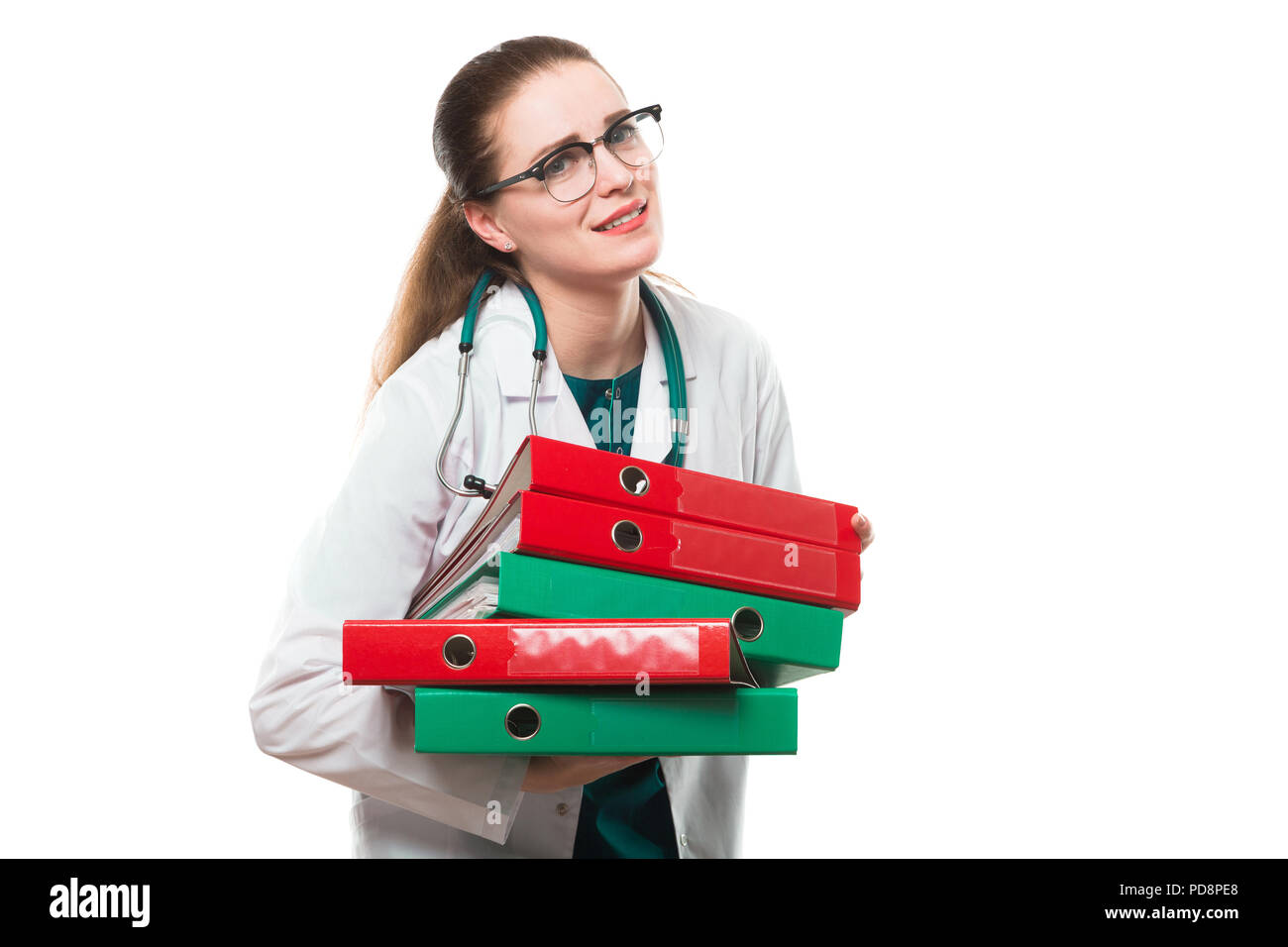 Attractive caucasian brunette sad female doctor standing in office with ...