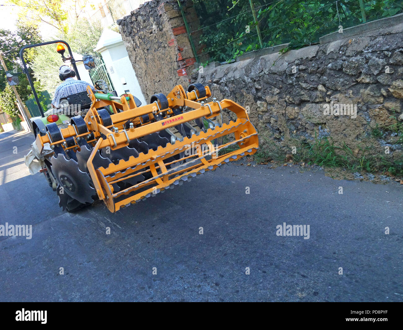 french farmer driving his tractor and tractor rotavator through the ...