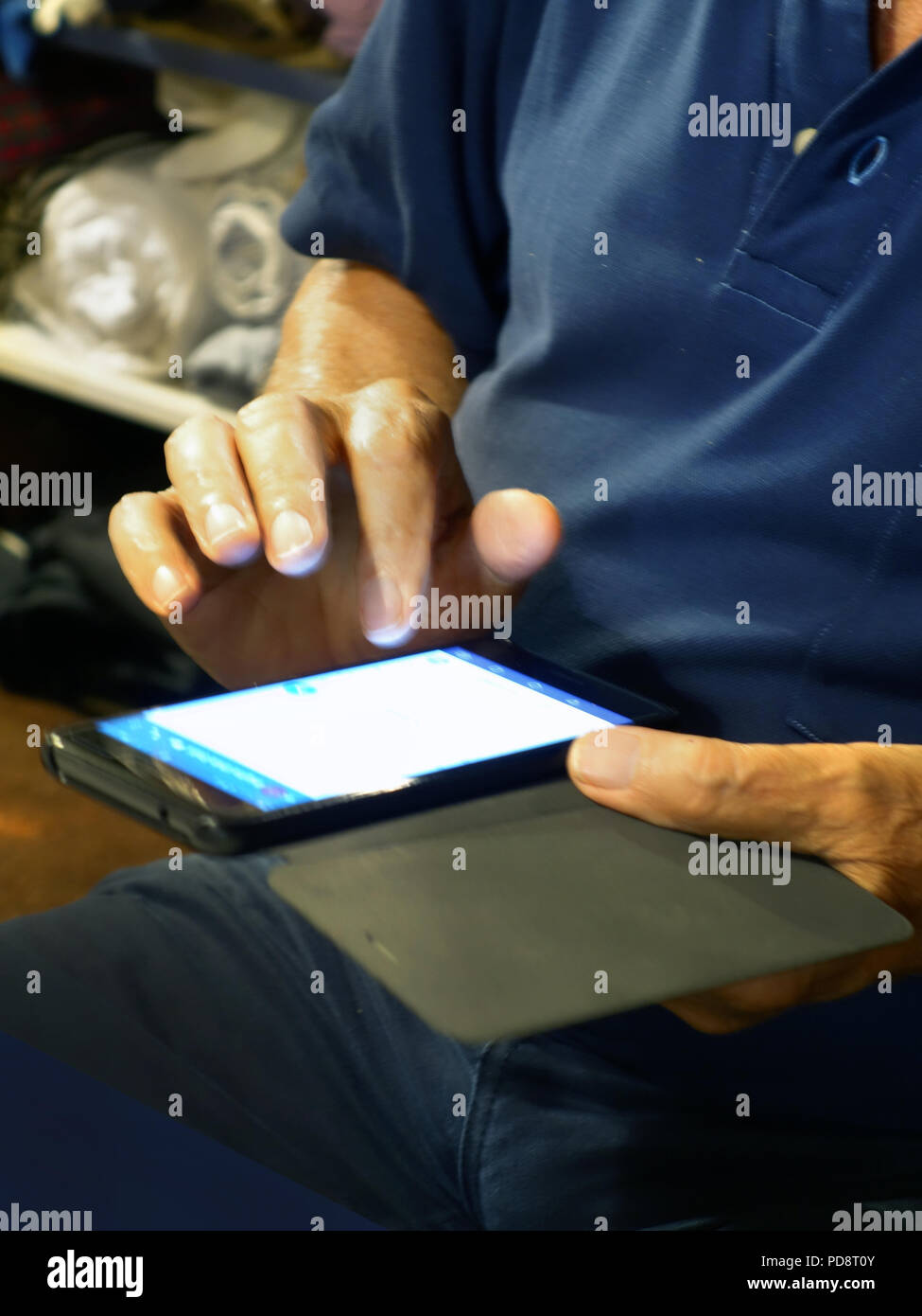 Old persons fingers using touch screen on mobile hi-res stock ...