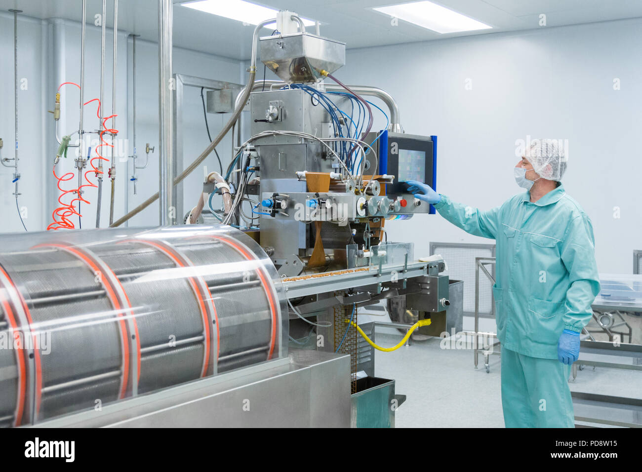 Pharmacy industry factory man worker in protective clothing in sterile ...