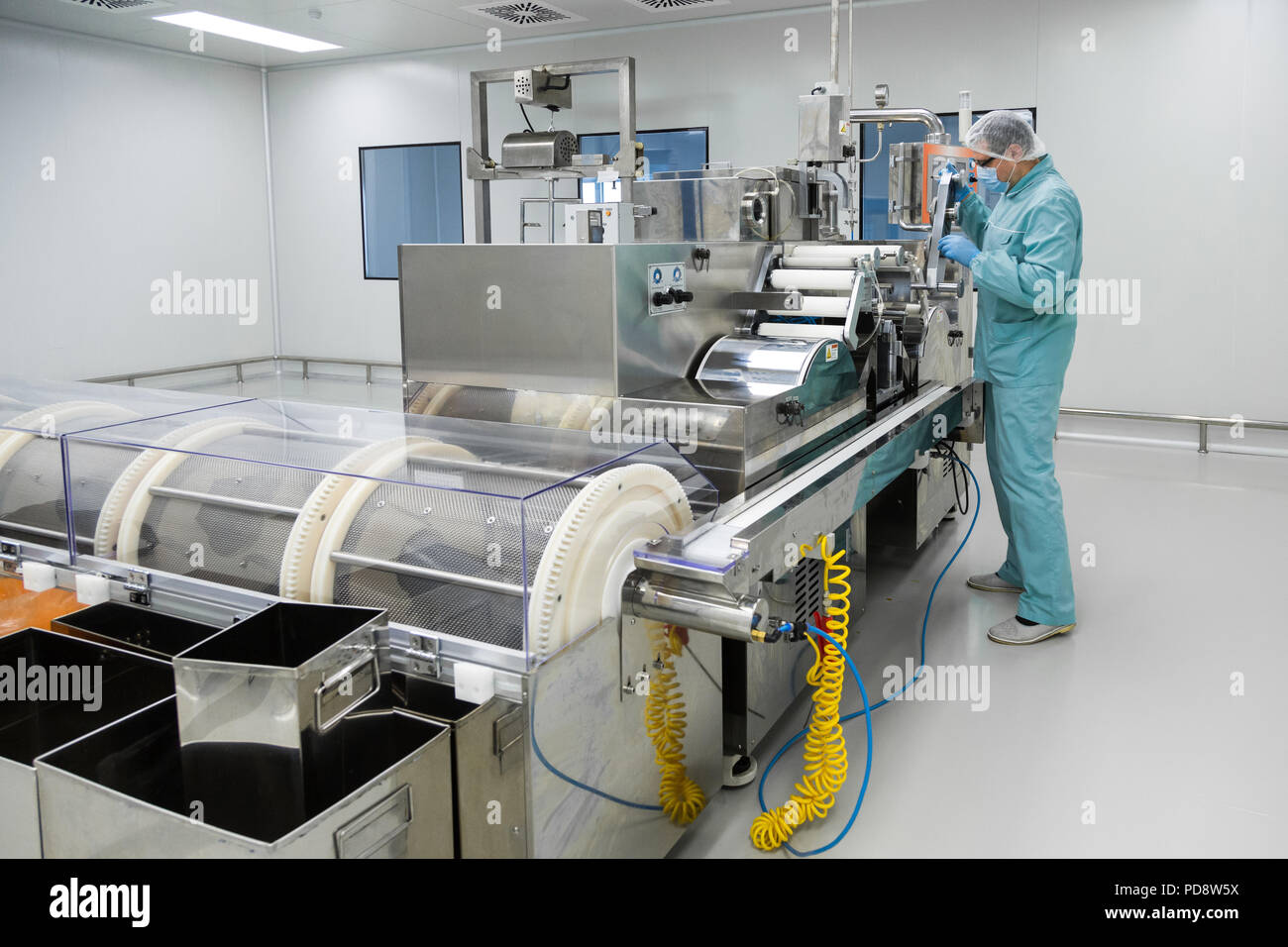Pharmacy industry factory man worker in protective clothing in sterile ...
