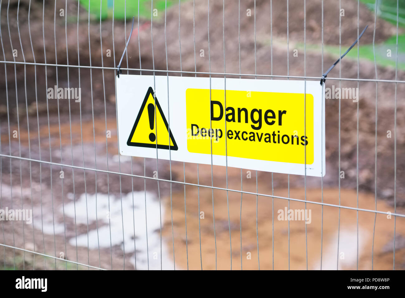 Caution deep excavation yellow warning sign on building site hi-res ...