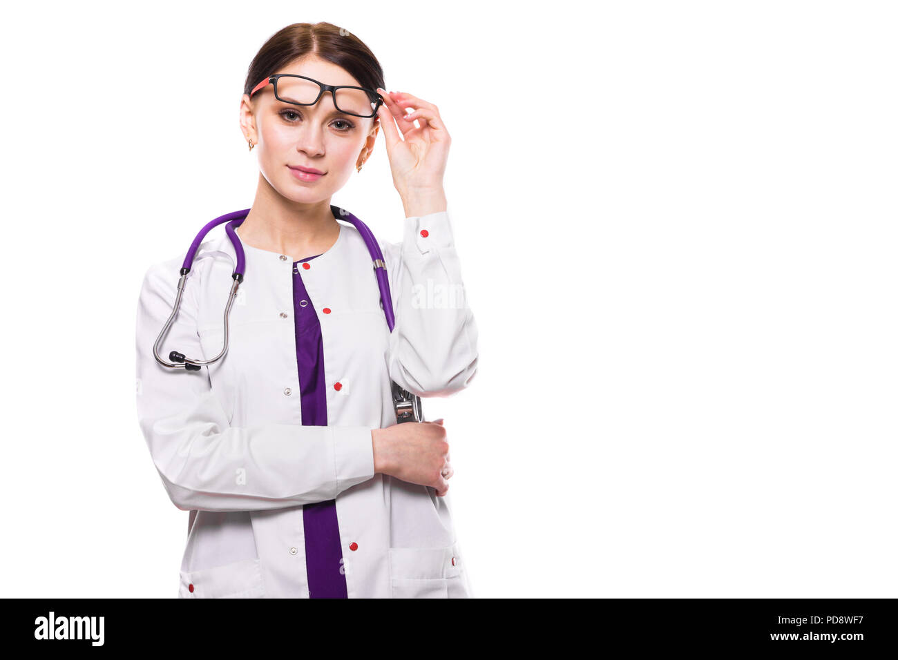 Young beautiful female doctor with raised glasses on white background ...