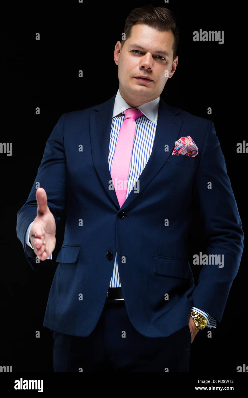 Portrait of confident handsome businessman offering his hand for ...