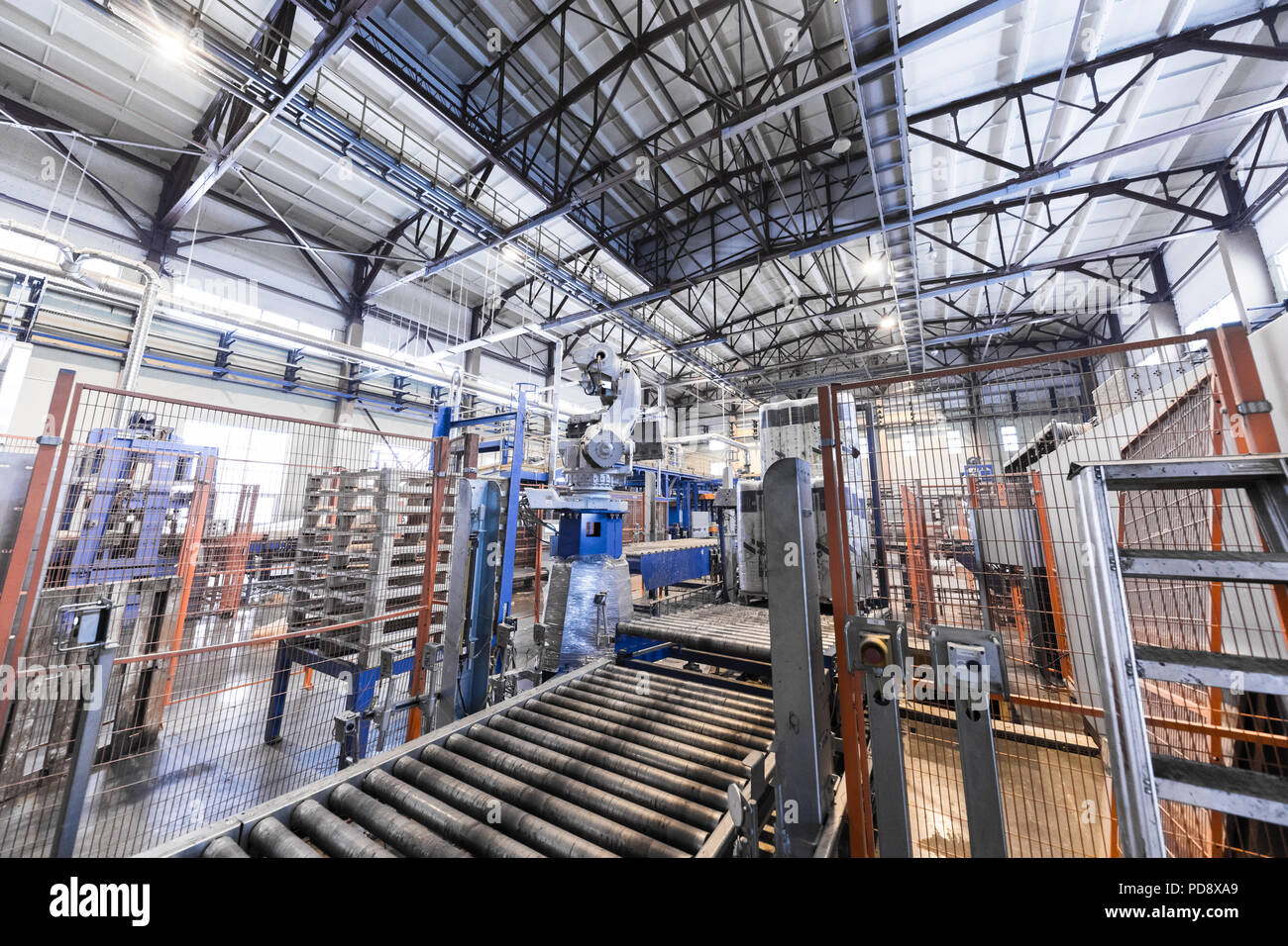 Factory workshop interior and machines on glass production background ...