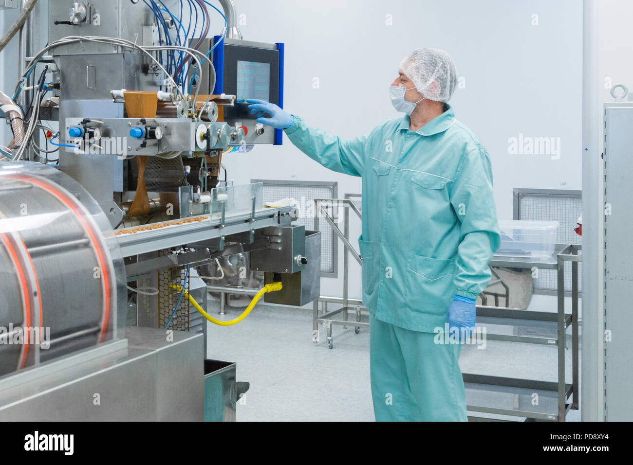 Pharmacy industry factory man worker in protective clothing in sterile ...