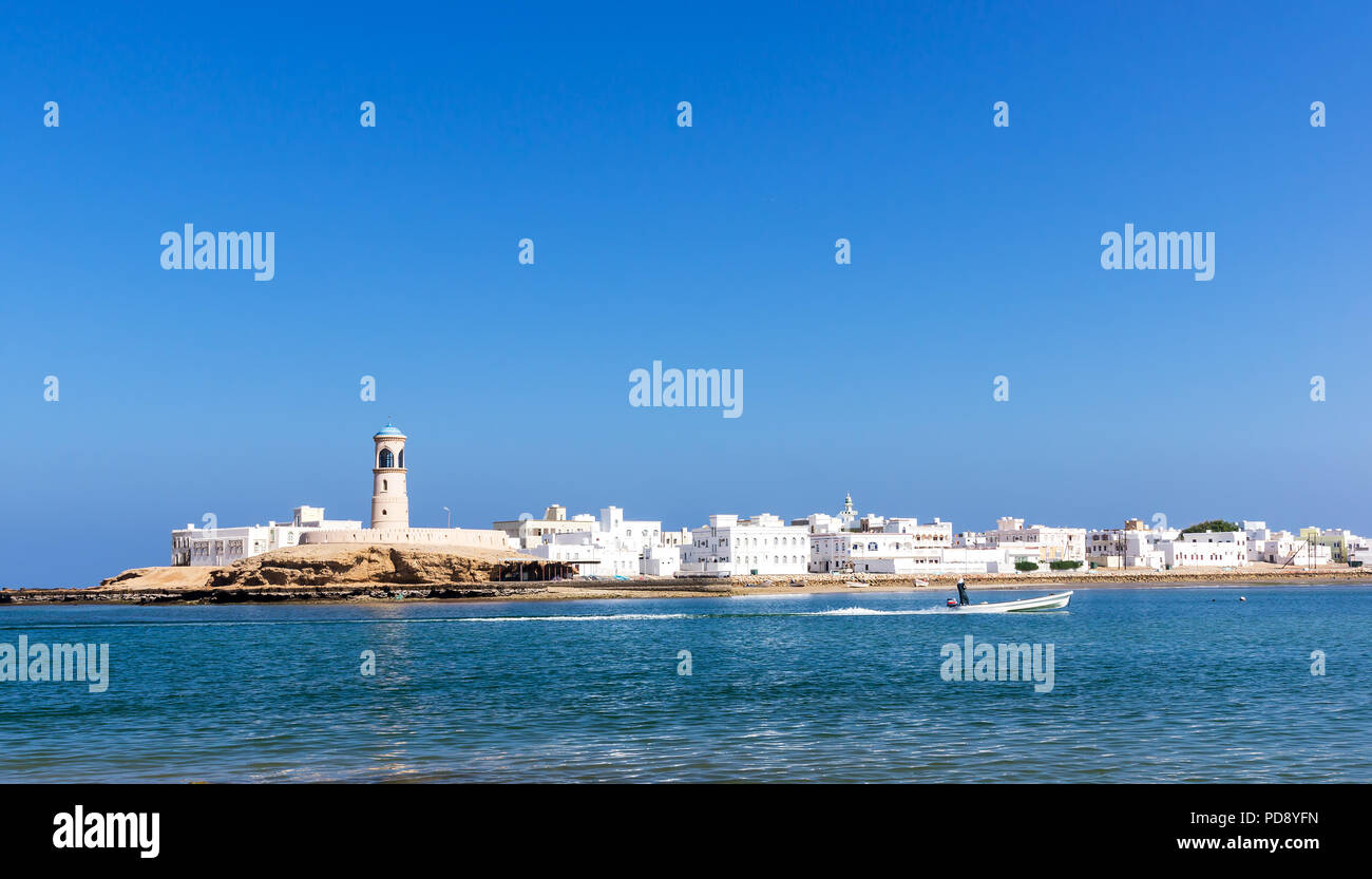 Sur Lighthouse with fisherman boat - Sur, Oman Stock Photo - Alamy