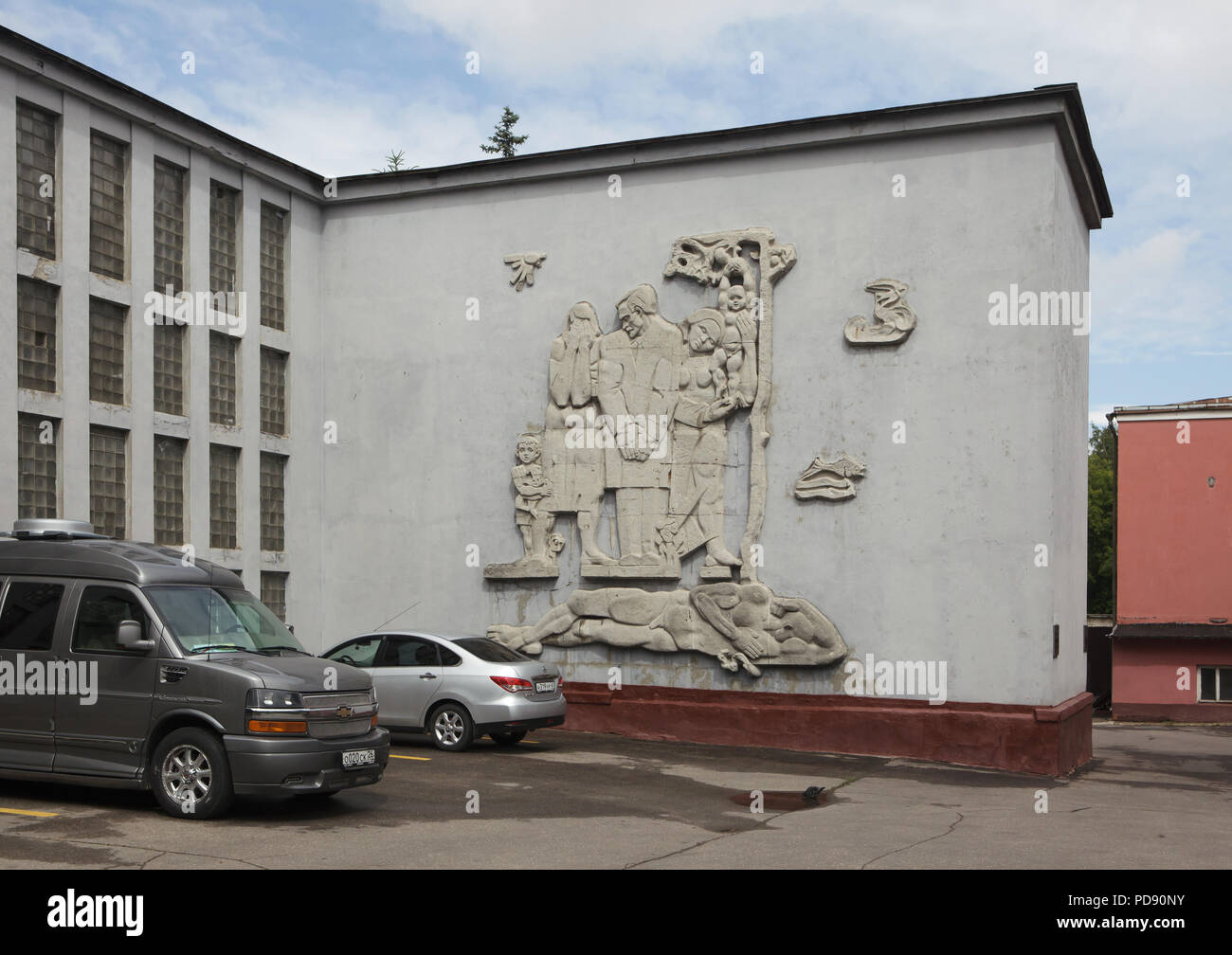 Family mourning over the dead person depicted in the concrete relief ...