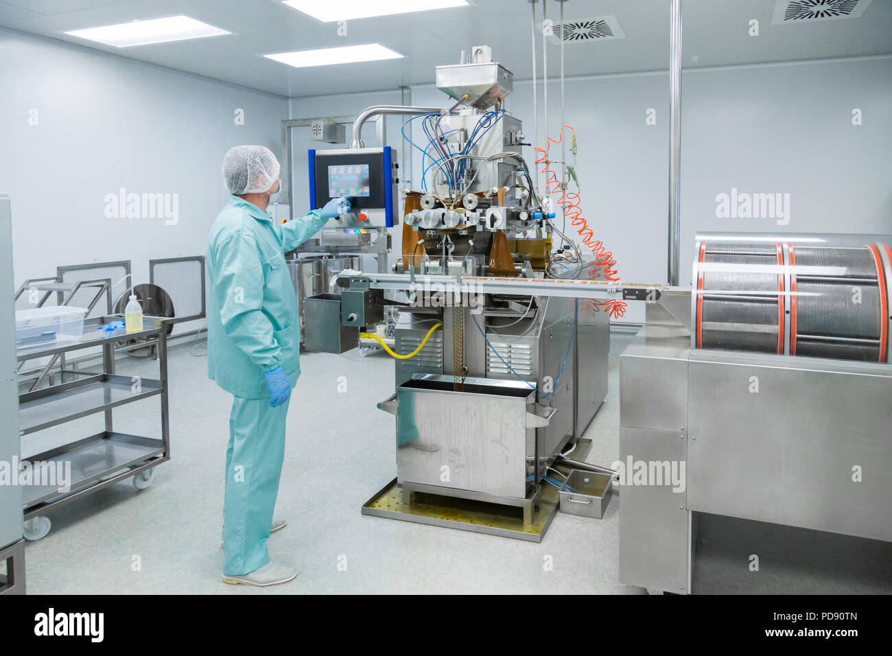 Pharmacy industry factory man worker in protective clothing in sterile ...