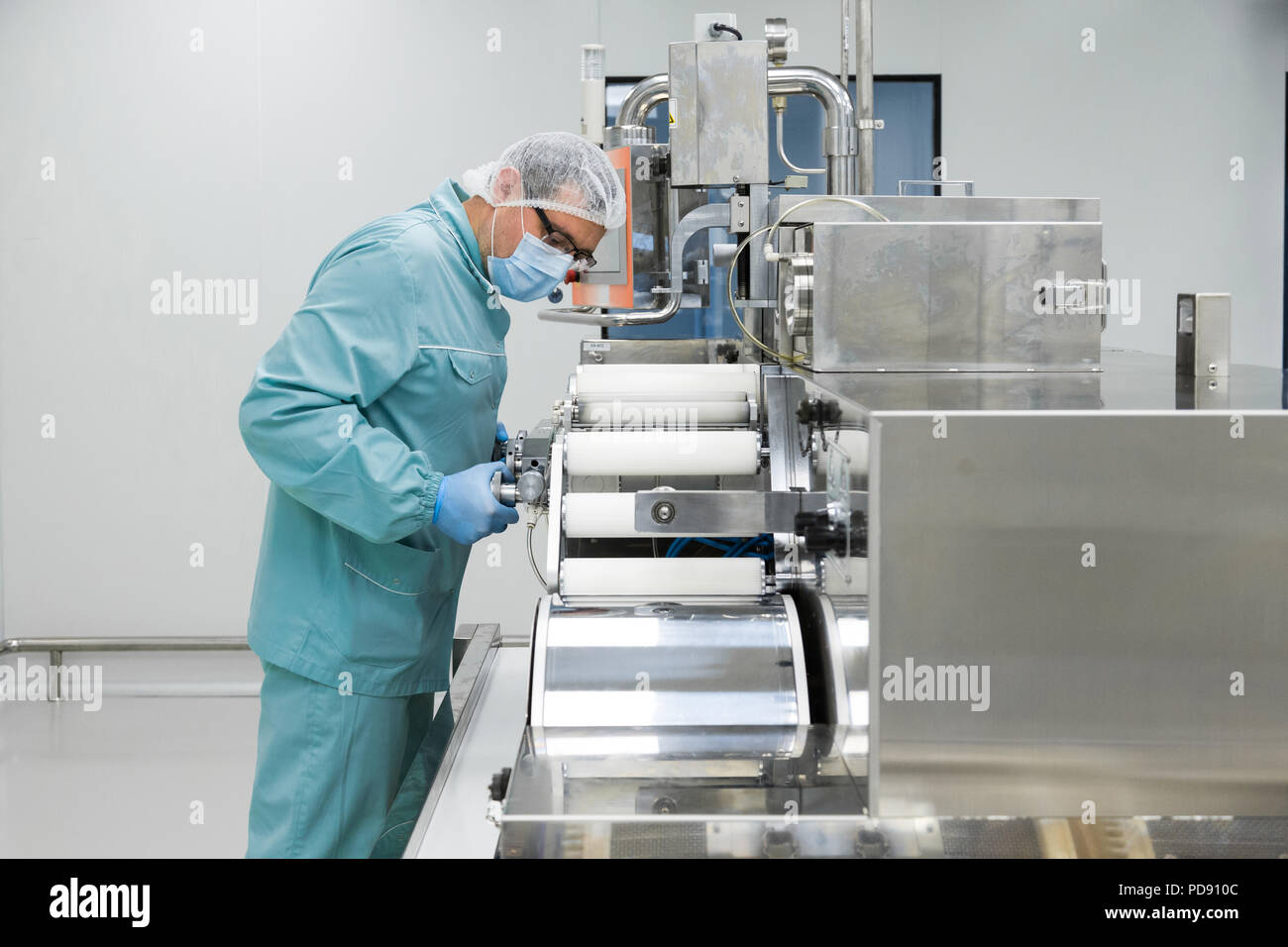 Pharmacy industry factory man worker in protective clothing in sterile ...