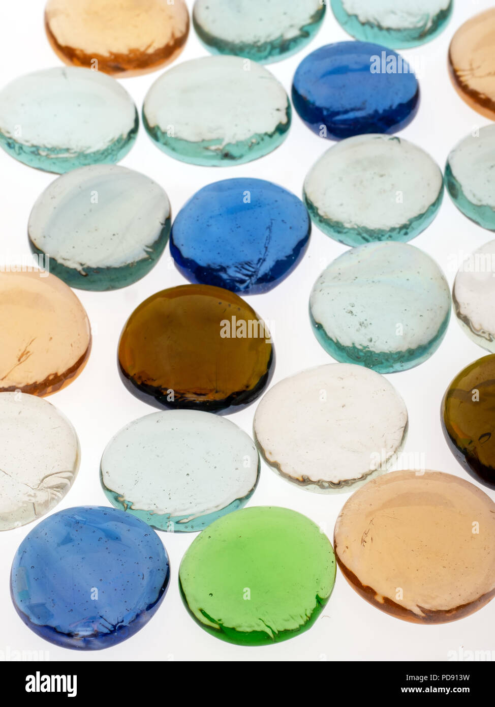 Abstract background from hand made glass pebbles of assorted colours on ...