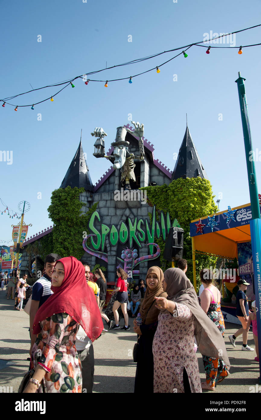Southend on Sea, Essex. Adventure Island fun fair. A group of Muslim ...