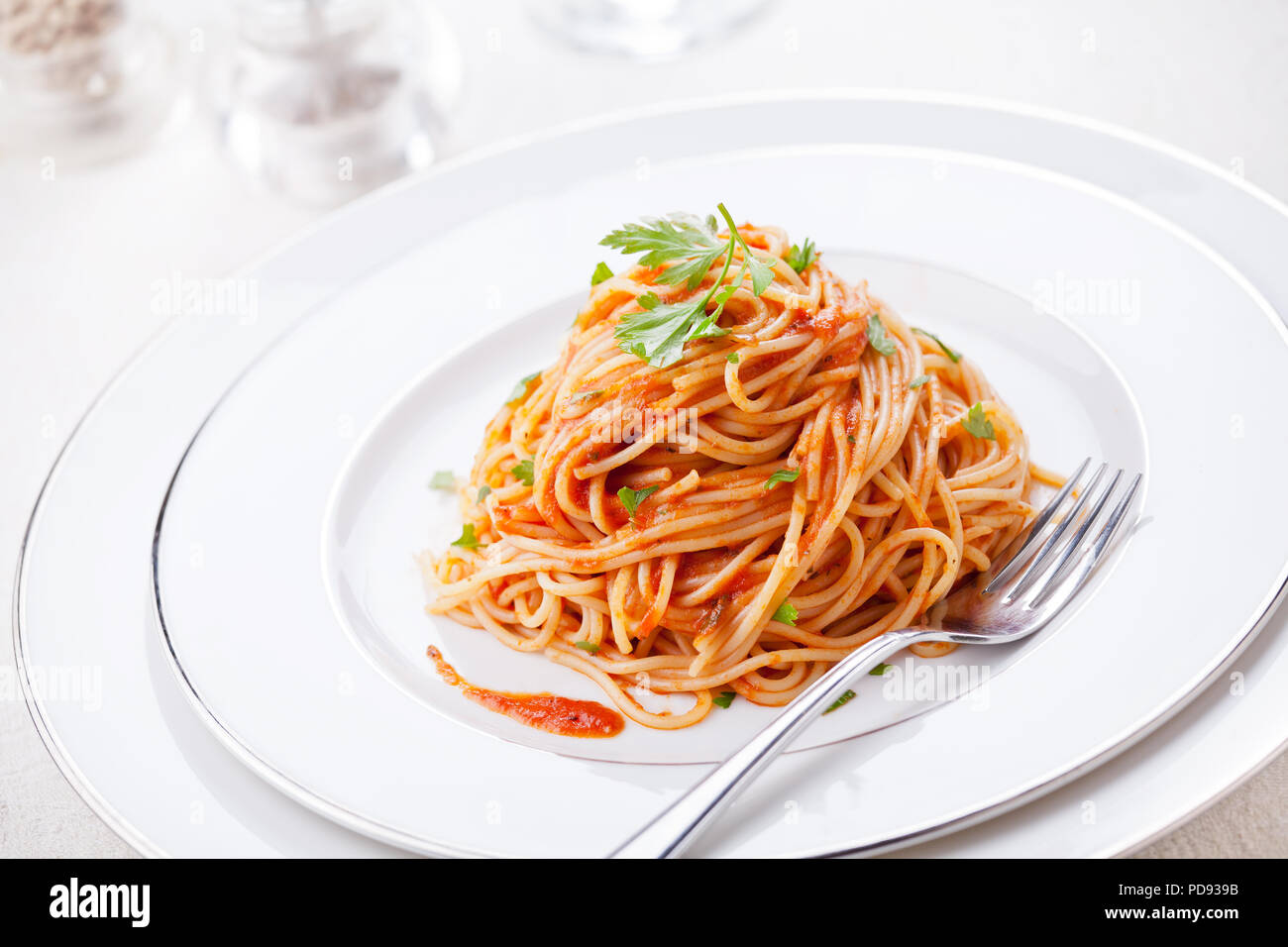Plate of pasta with homemade tomato sauce and parsley Stock Photo - Alamy