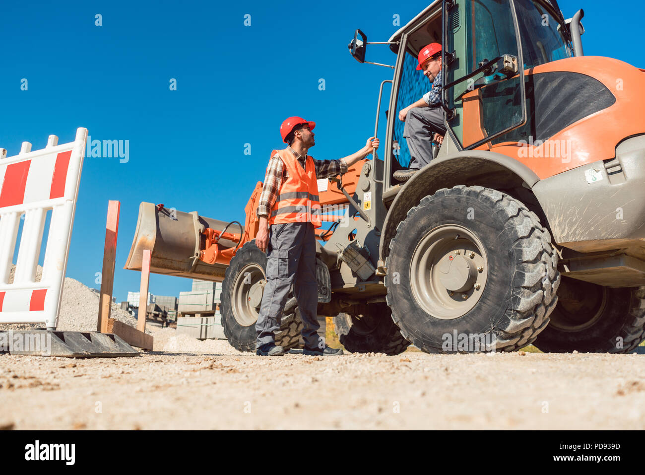 Construction worker starting road works on site Stock Photo - Alamy