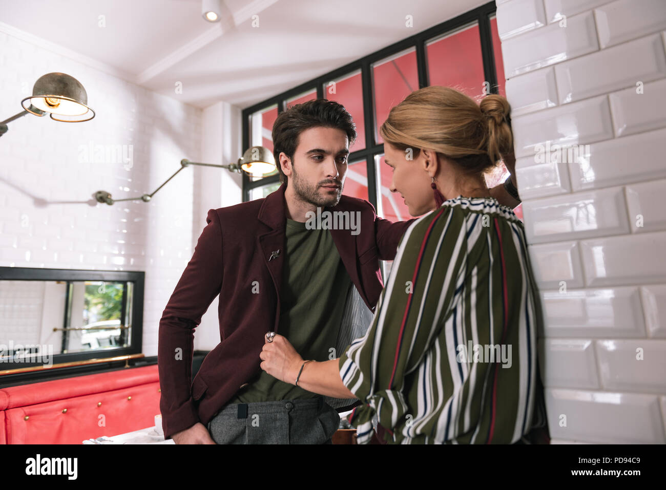 Focused beautiful couple having discussion Stock Photo - Alamy