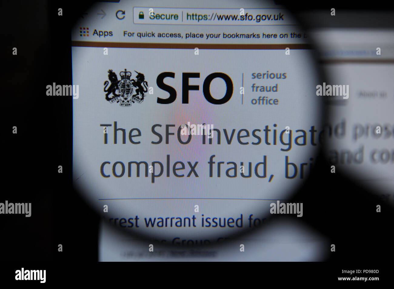 The Serious Fraud Office website seen through a magnifying glass Stock ...
