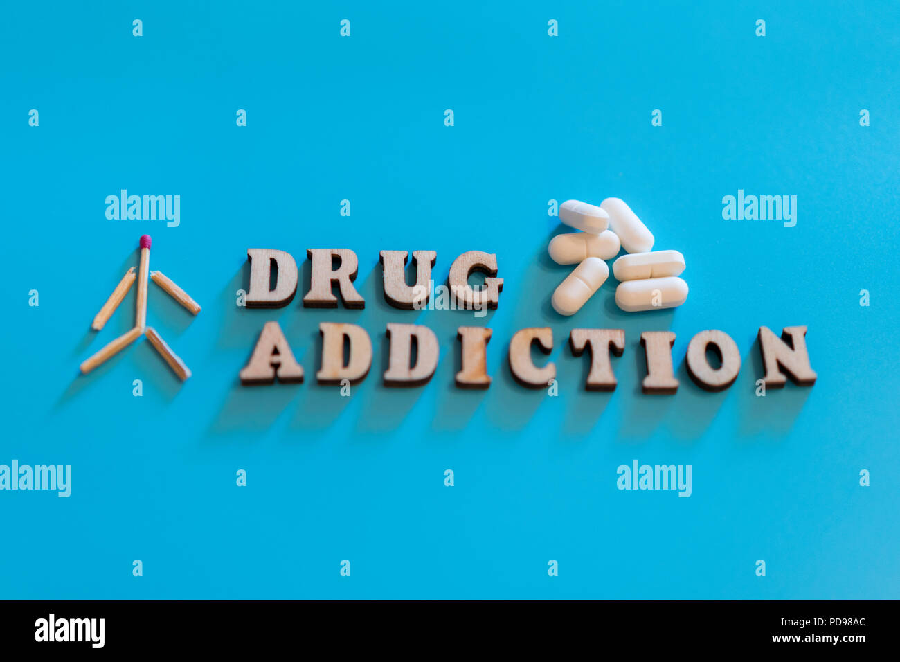 drug addiction concept. human figure, drugs, drug addiction on a blue ...