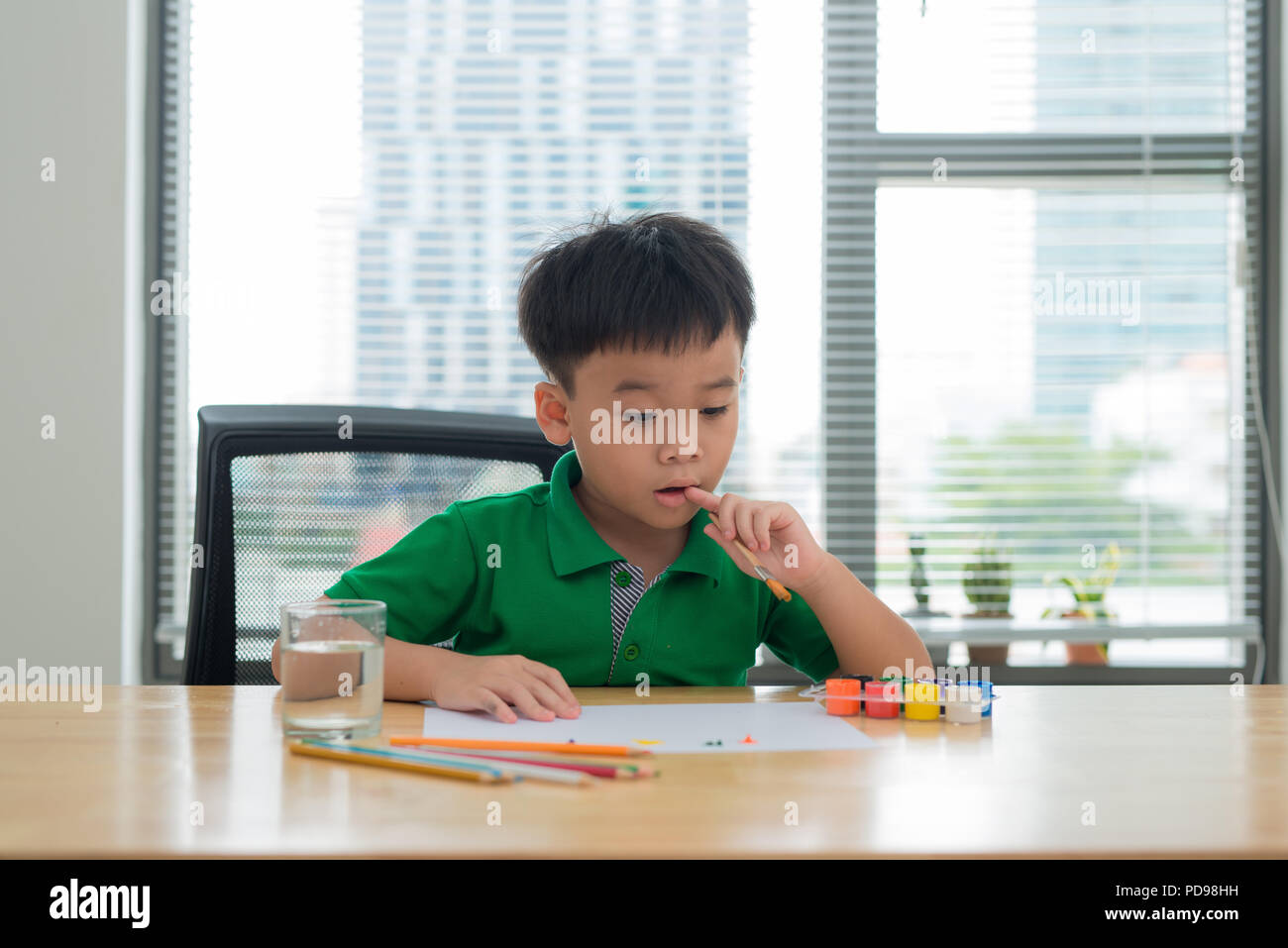 Kids doing homework table hi-res stock photography and images - Alamy