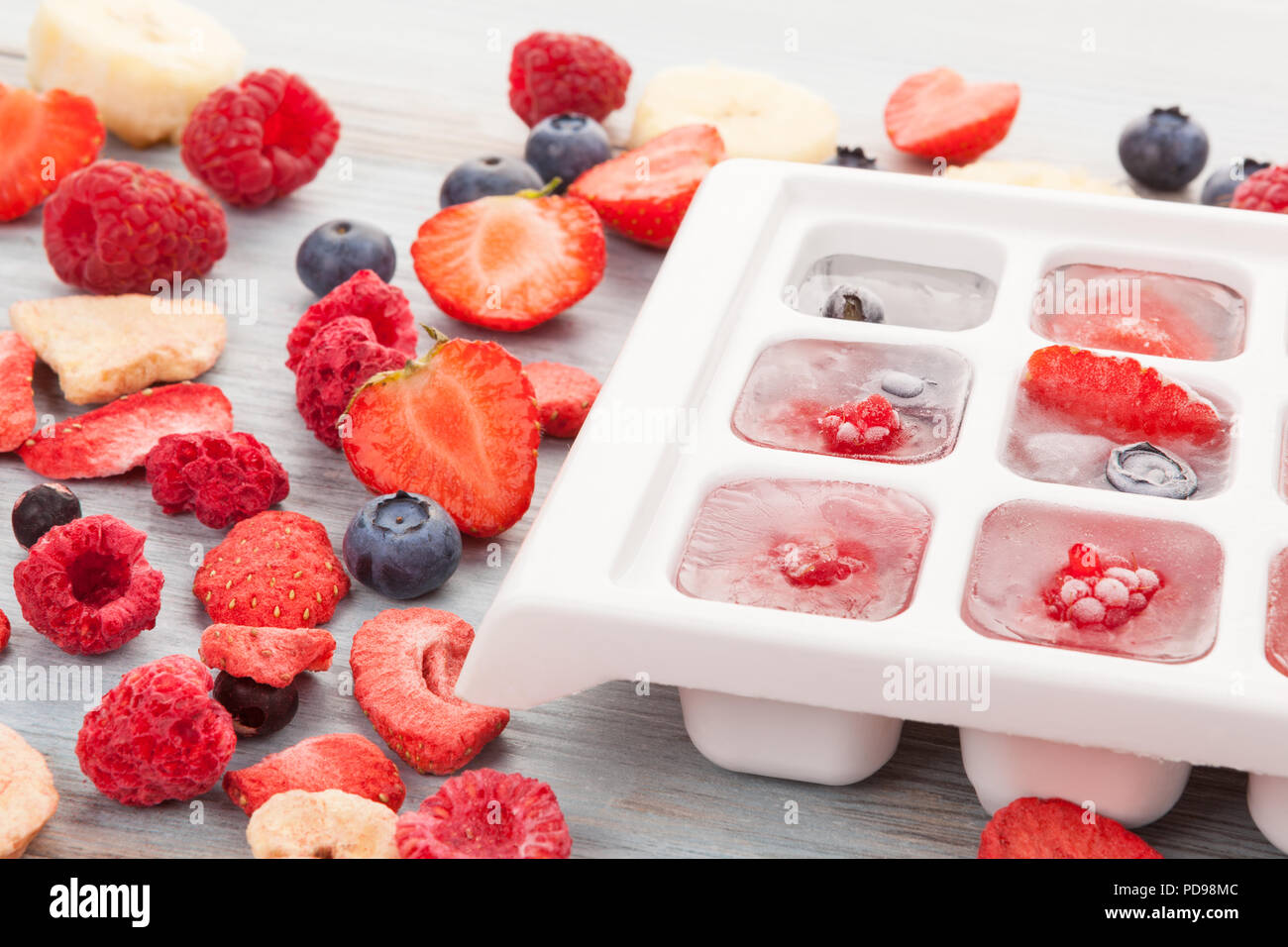 Ice tray with fruit on white background top view. Dehydrated freeze ...
