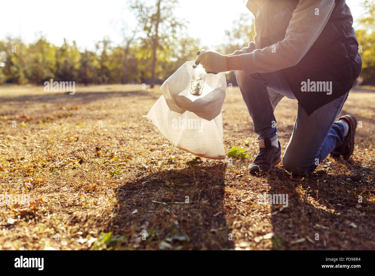Man Picking Up Trash