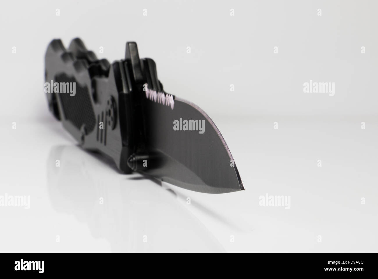 Tip of a sharp knife. Black Survival knife on white background Stock ...