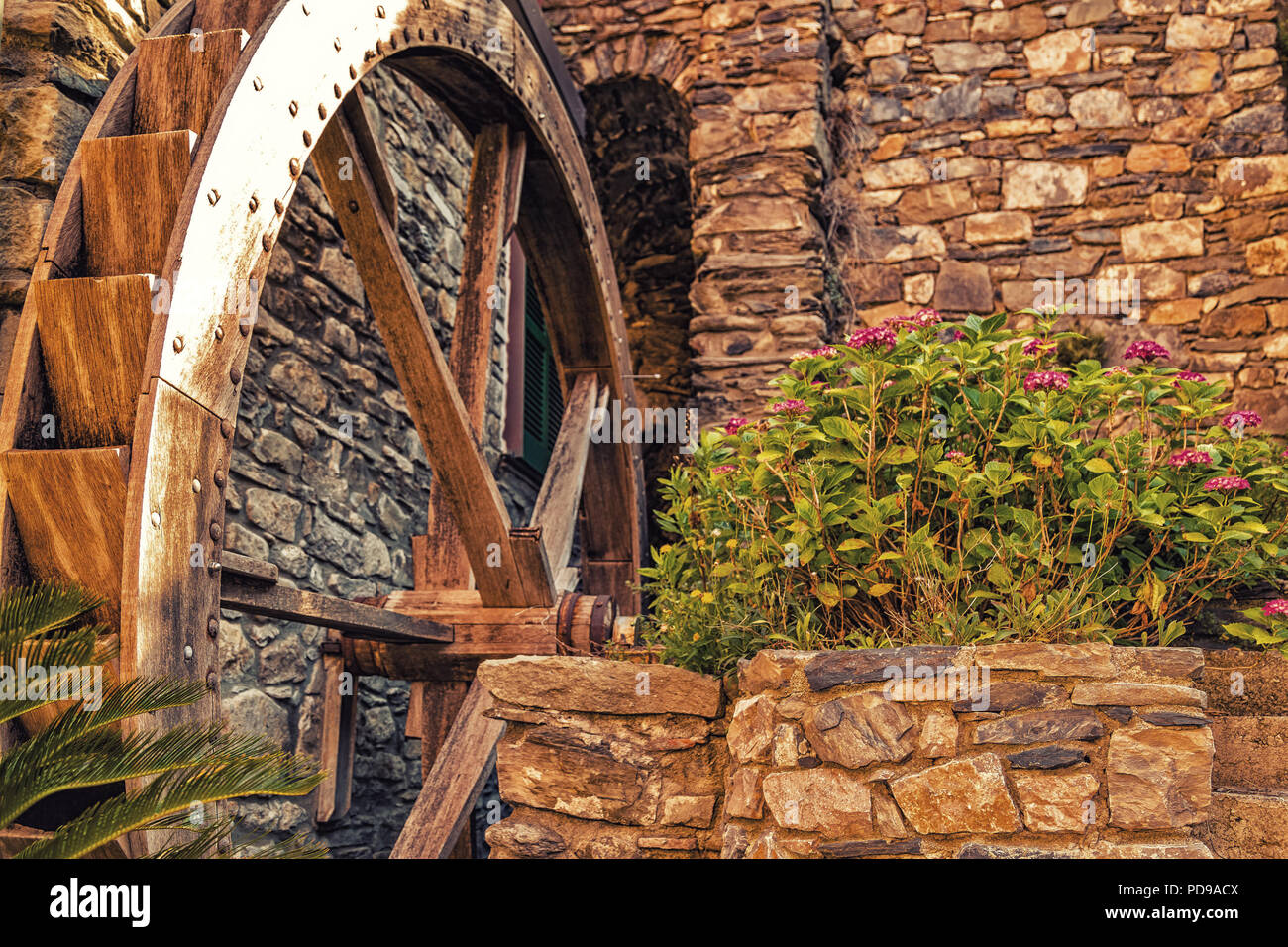 vintage background of Wooden Wheel of Old Mill Stock Photo - Alamy